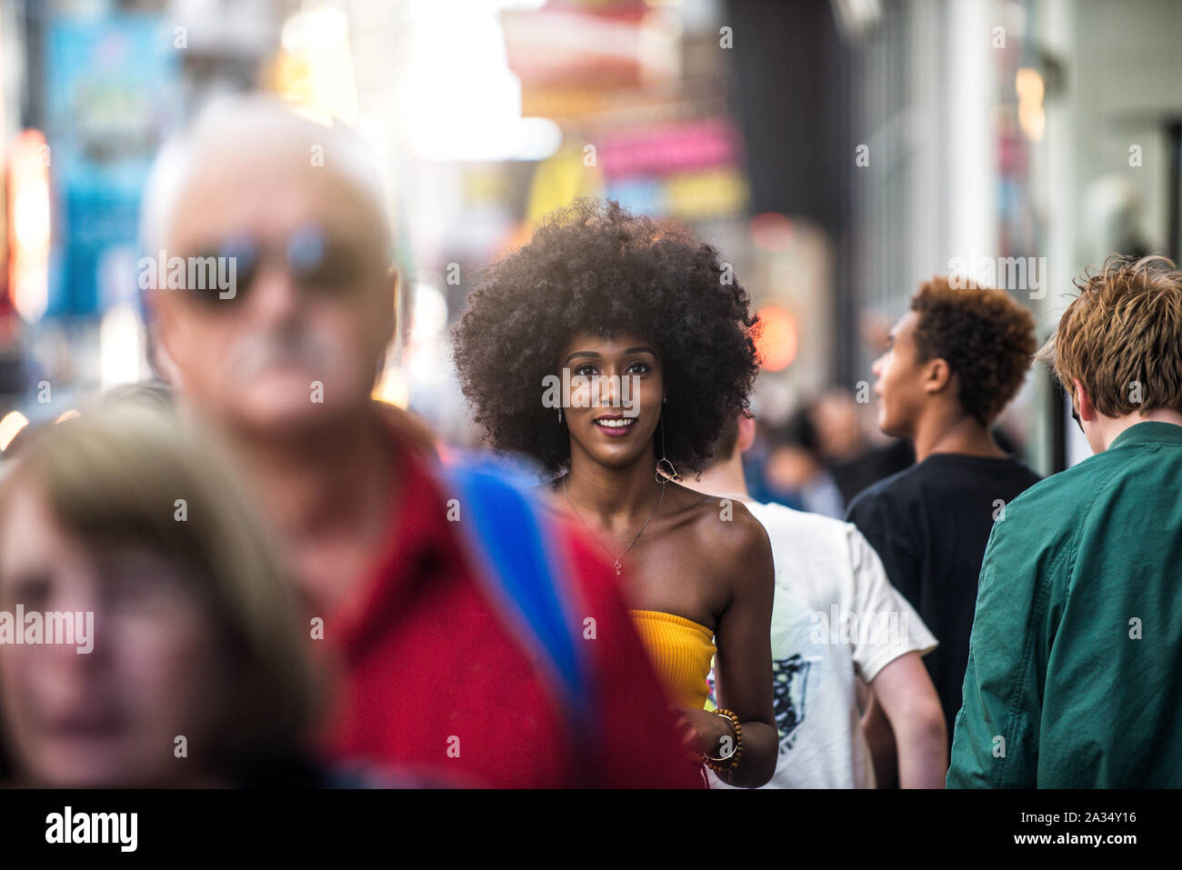 Young beautiful girl walking in Time square, manhattan. Lifestyle ...