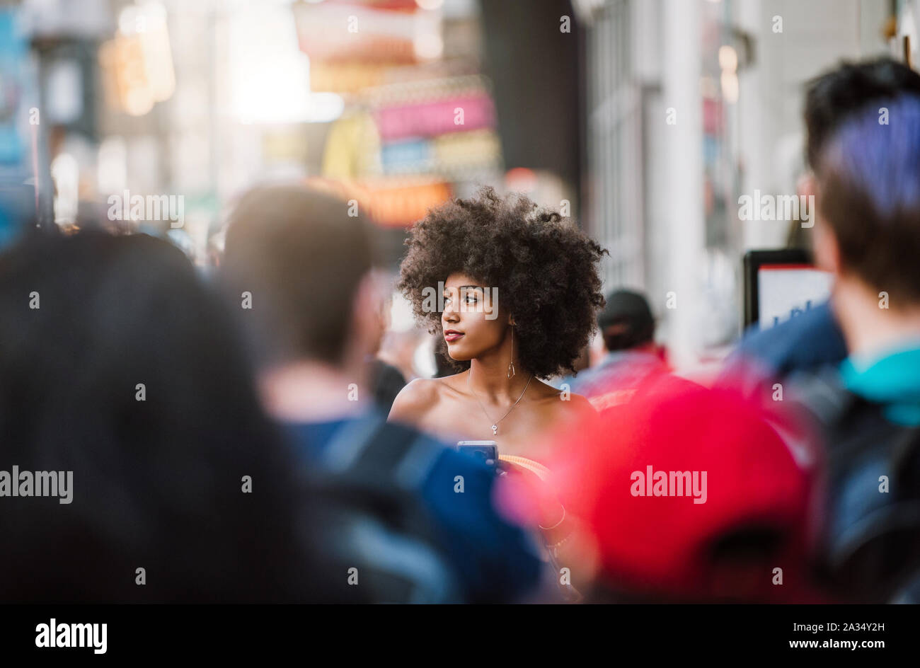 Young beautiful girl walking in Time square, manhattan. Lifestyle ...