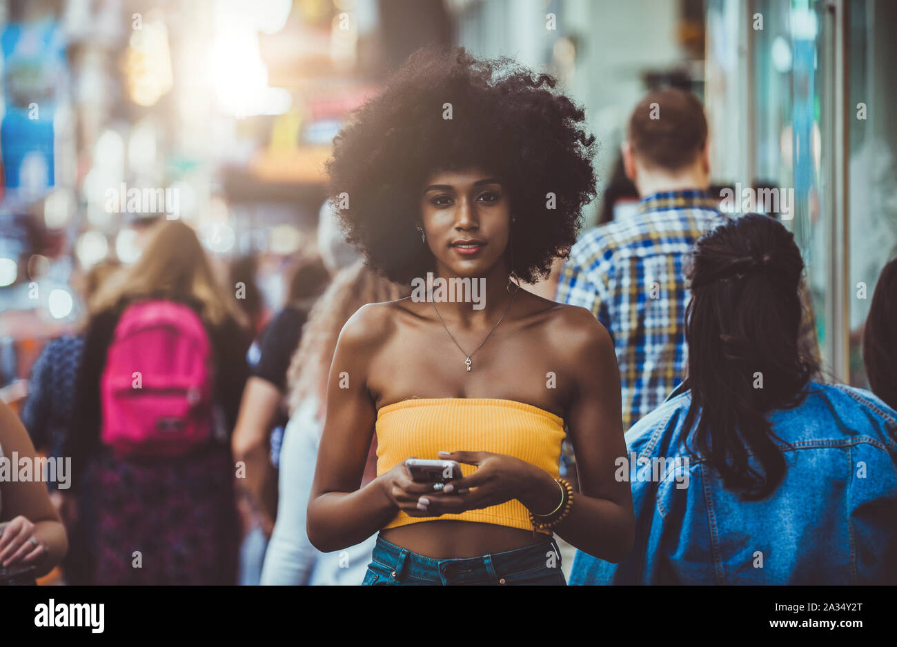 Young beautiful girl walking in Time square, manhattan. Lifestyle ...