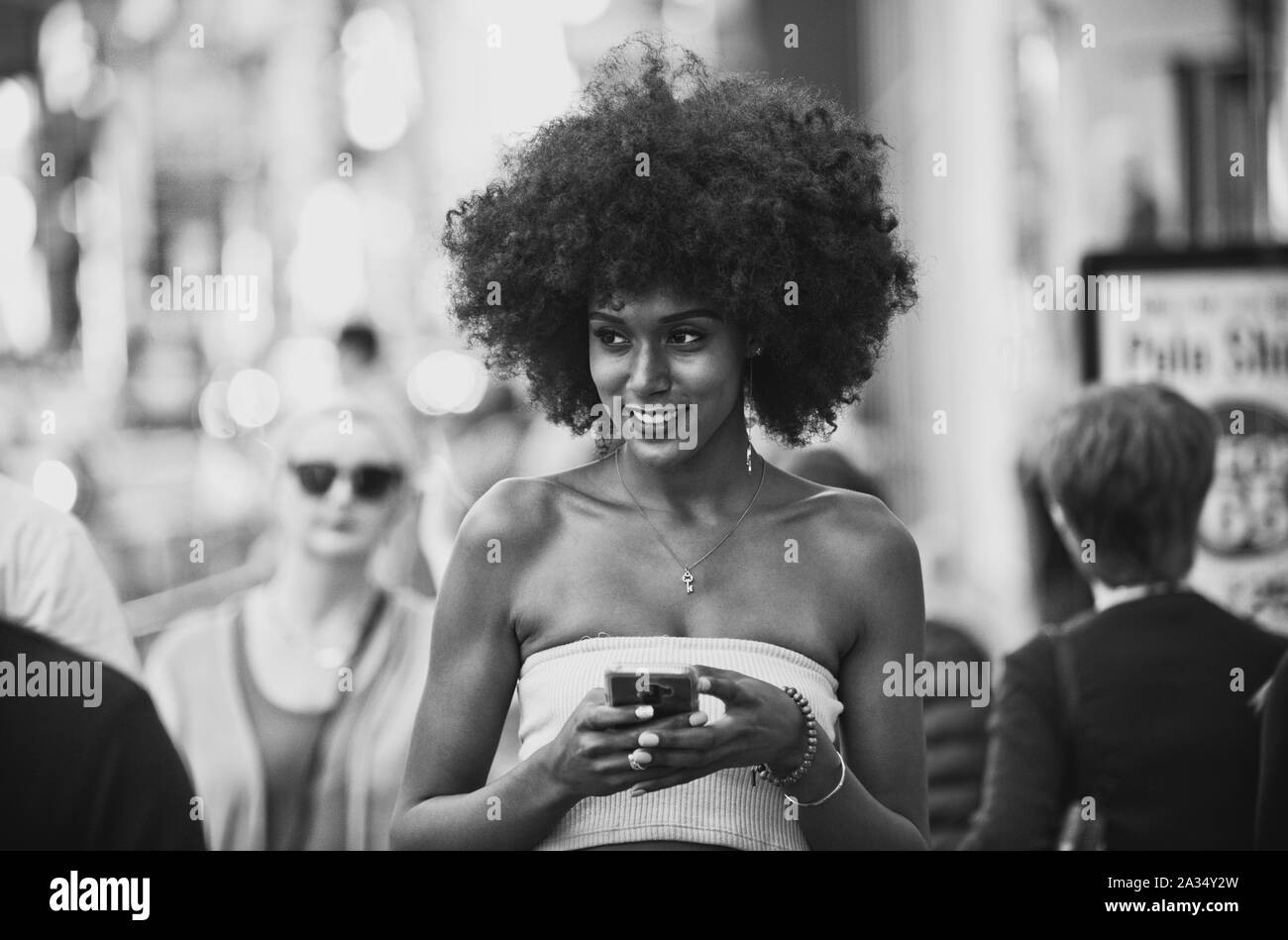 Young beautiful girl walking in Time square, manhattan. Lifestyle ...