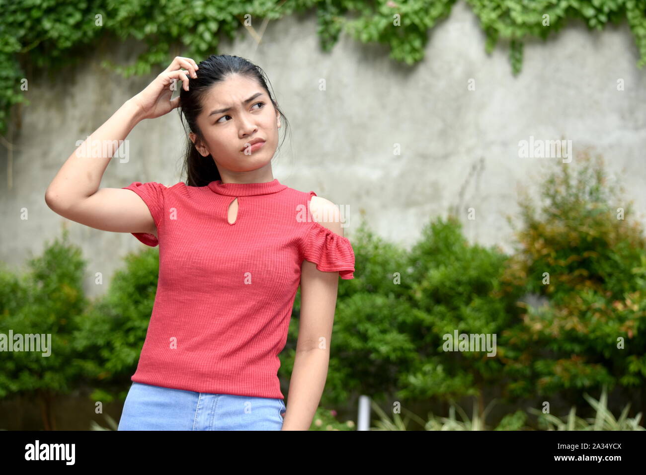 A Confused Young Minority Person Stock Photo - Alamy