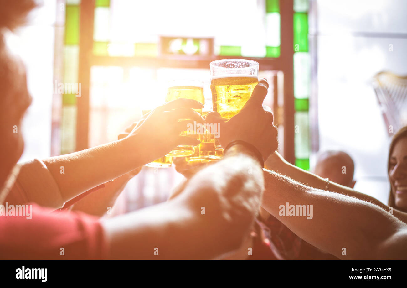 Group of teens having fun in a pub Stock Photo - Alamy