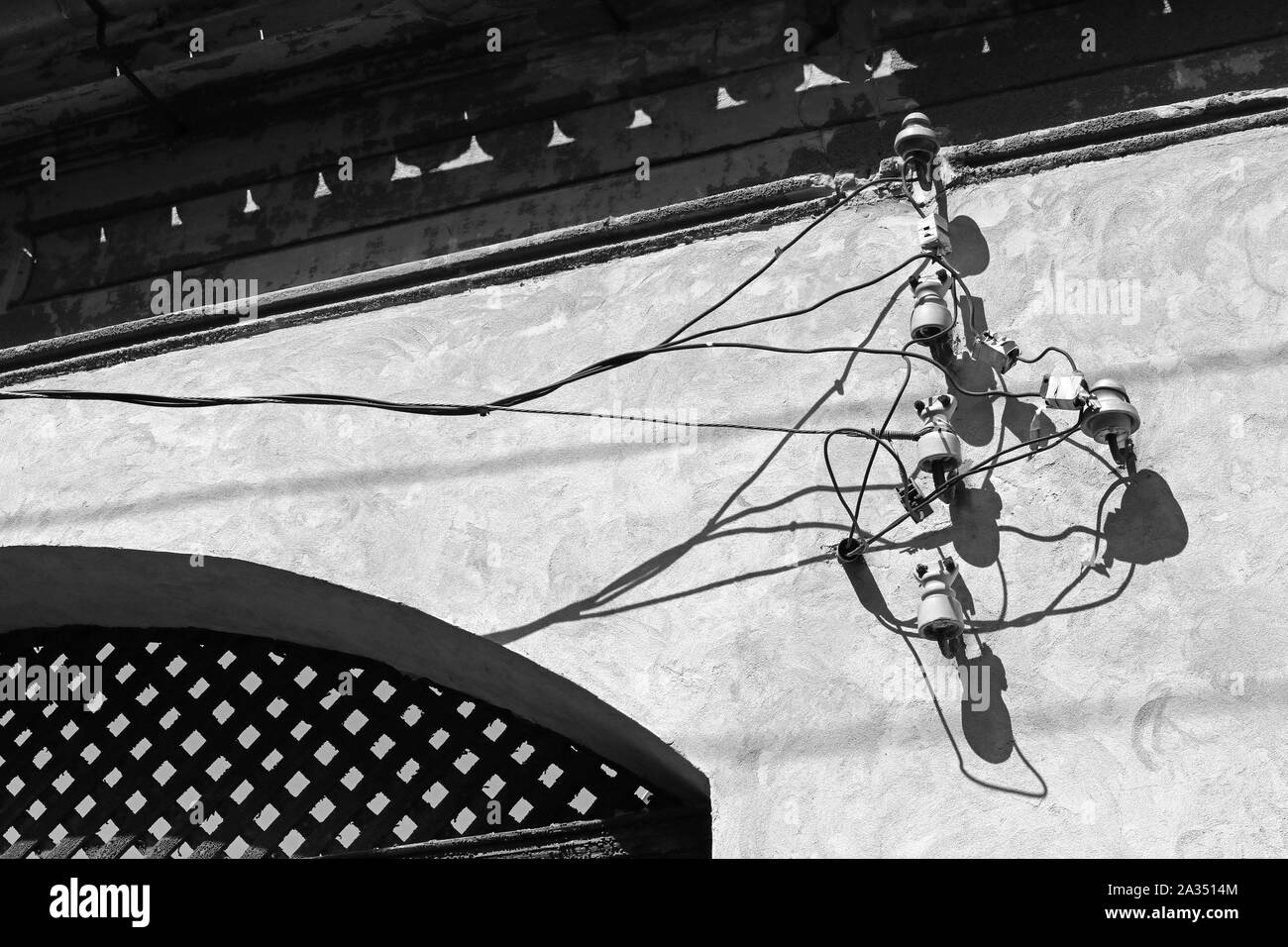 Eletcticity cables and telephone lines on the wall Stock Photo - Alamy