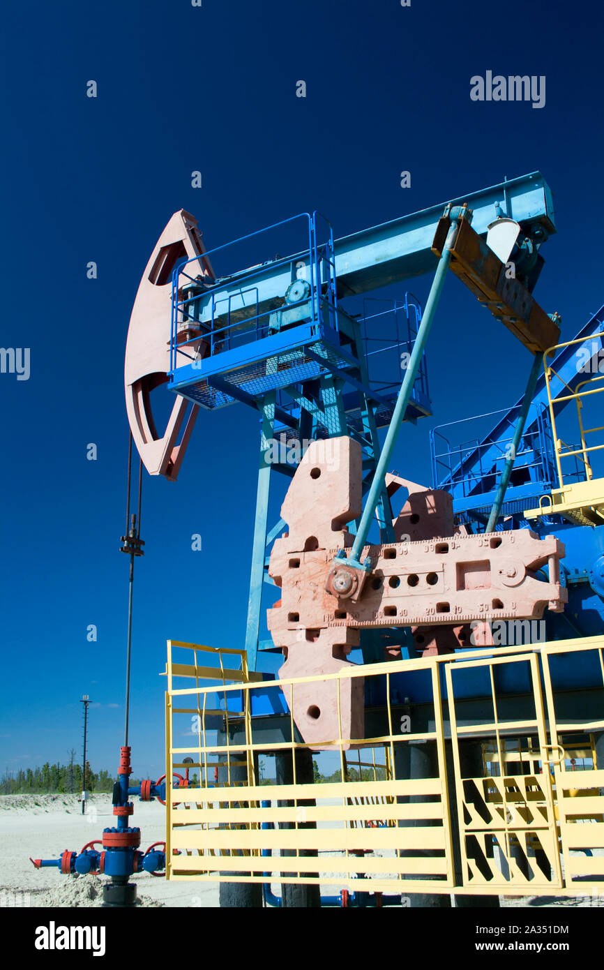 Oil and gas industry. Work of oil pump jack on a oil field Stock Photo ...