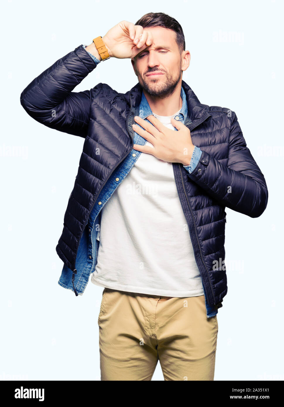 Handsome man wearing winter coat Touching forehead for illness and ...