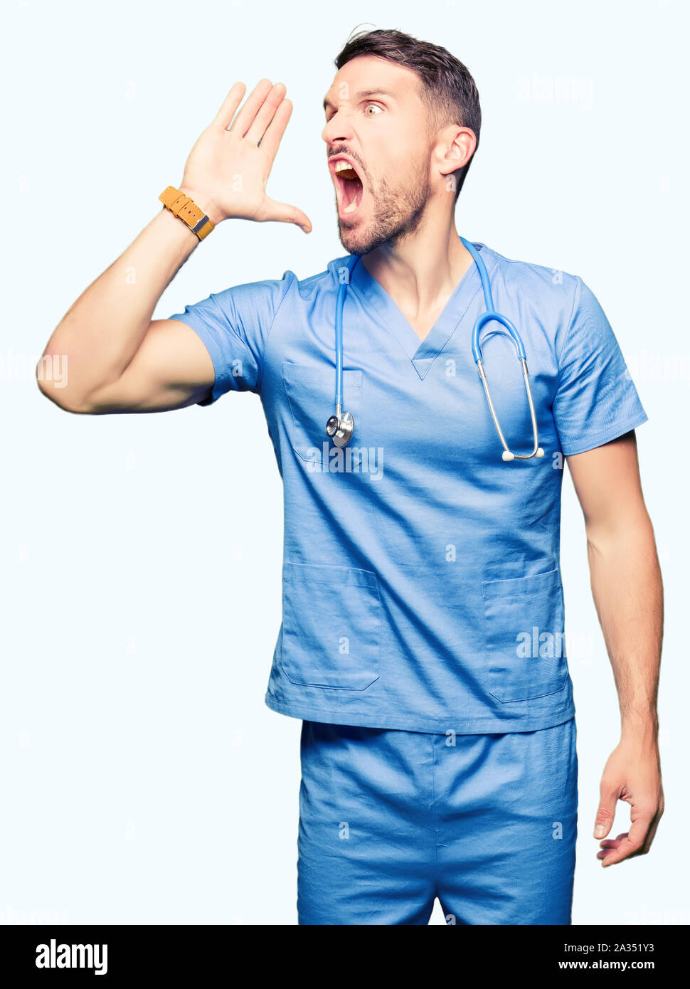 Handsome doctor man wearing medical uniform over isolated background ...