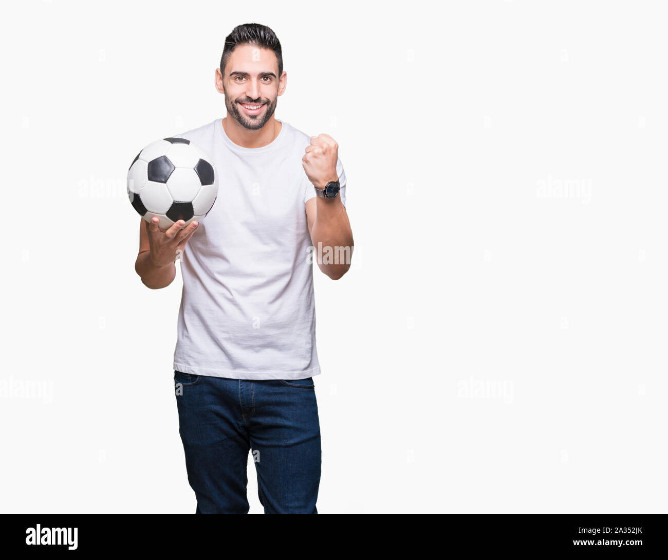 Young man holding soccer football ball over isolated background ...