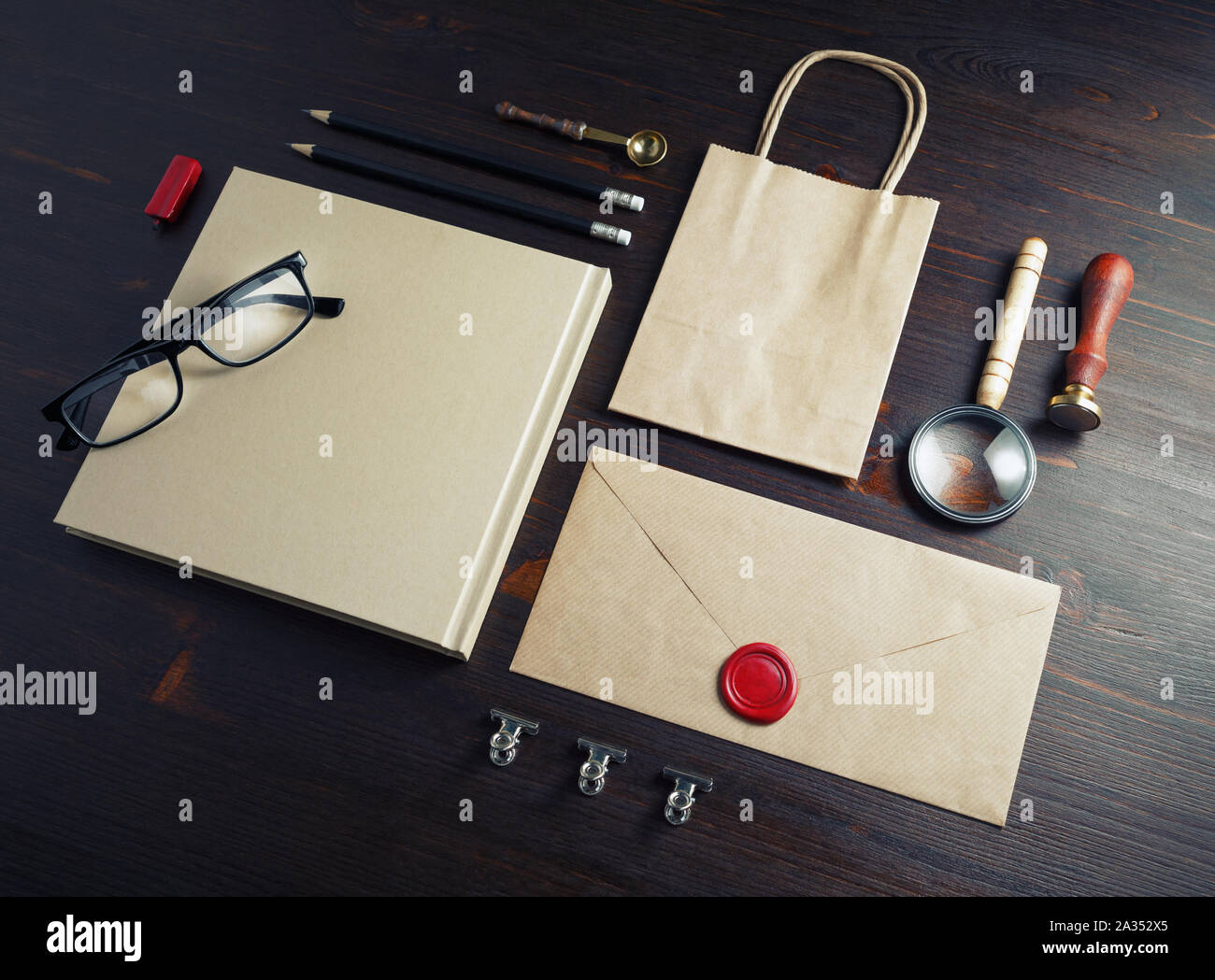 Blank branding identity set on wooden background. Kraft paper ...