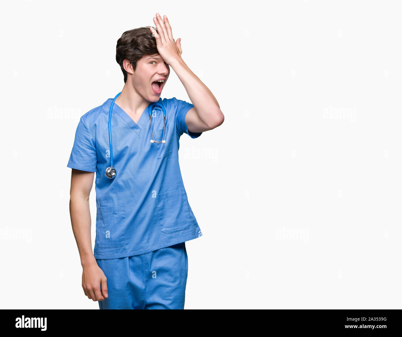 Young doctor wearing medical uniform over isolated background surprised ...