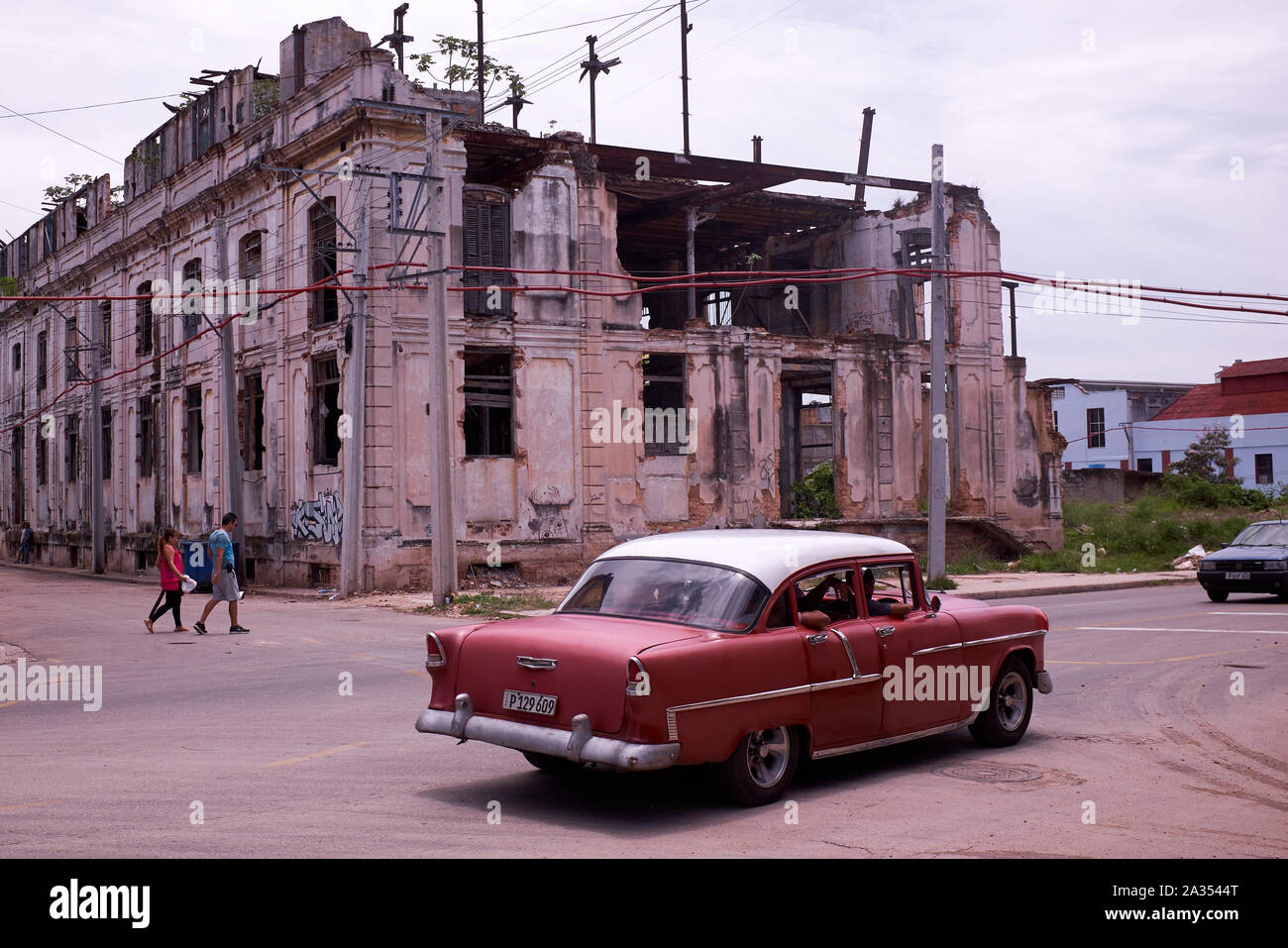 Derelict buildings and classic cars are commonplace in Cuba Stock Photo ...