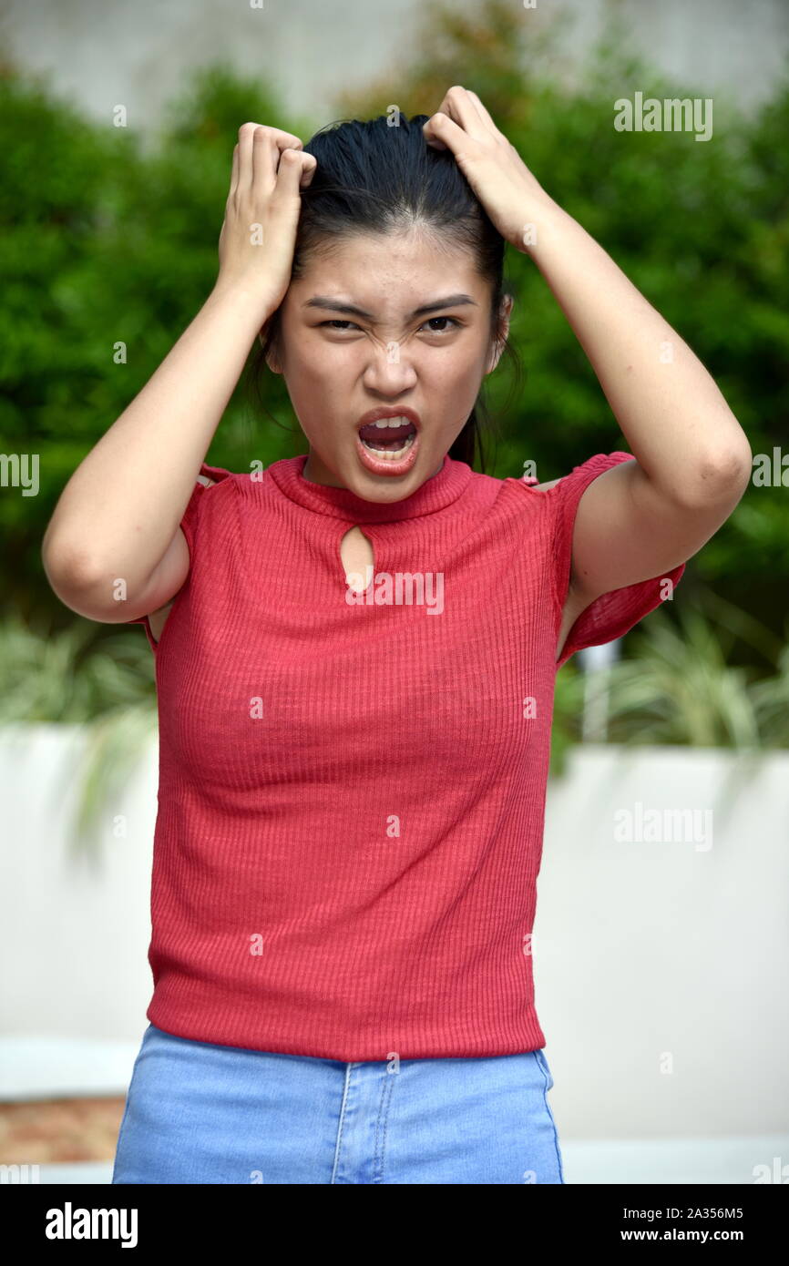 An Anxious Young Filipina Person Stock Photo - Alamy