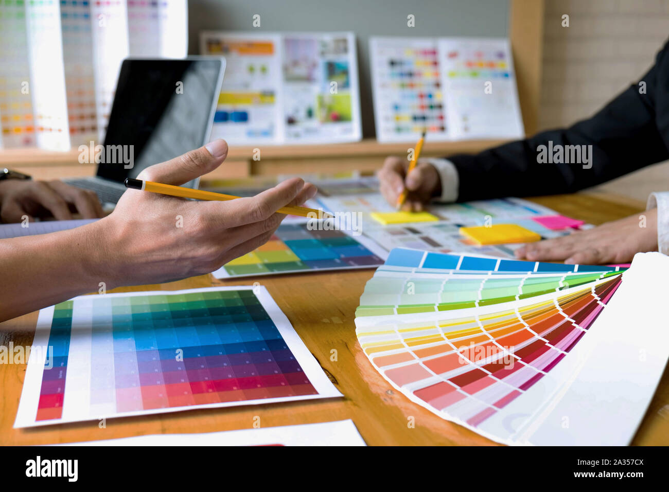 Graphic designers choose colors from the color bands samples for design ...