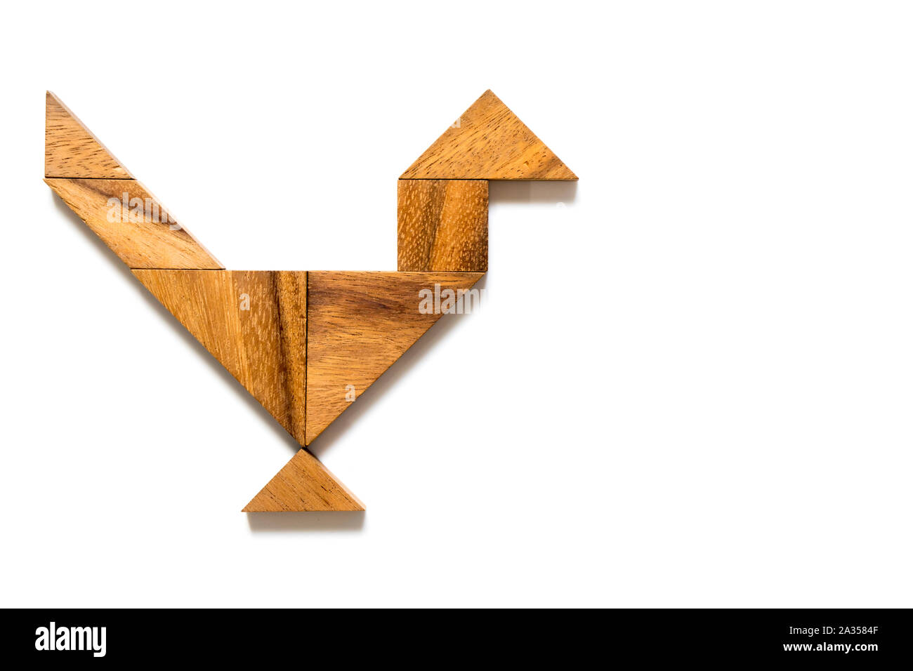Wooden tangram puzzle in bird shape on white background Stock Photo - Alamy