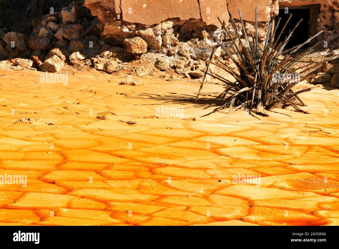 Colorful orange sediments deposited in a dry lake of an old abandoned ...