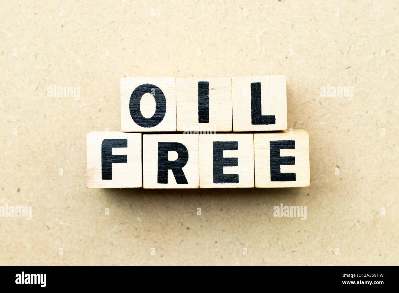 Letter block in word oil free on wood background Stock Photo - Alamy