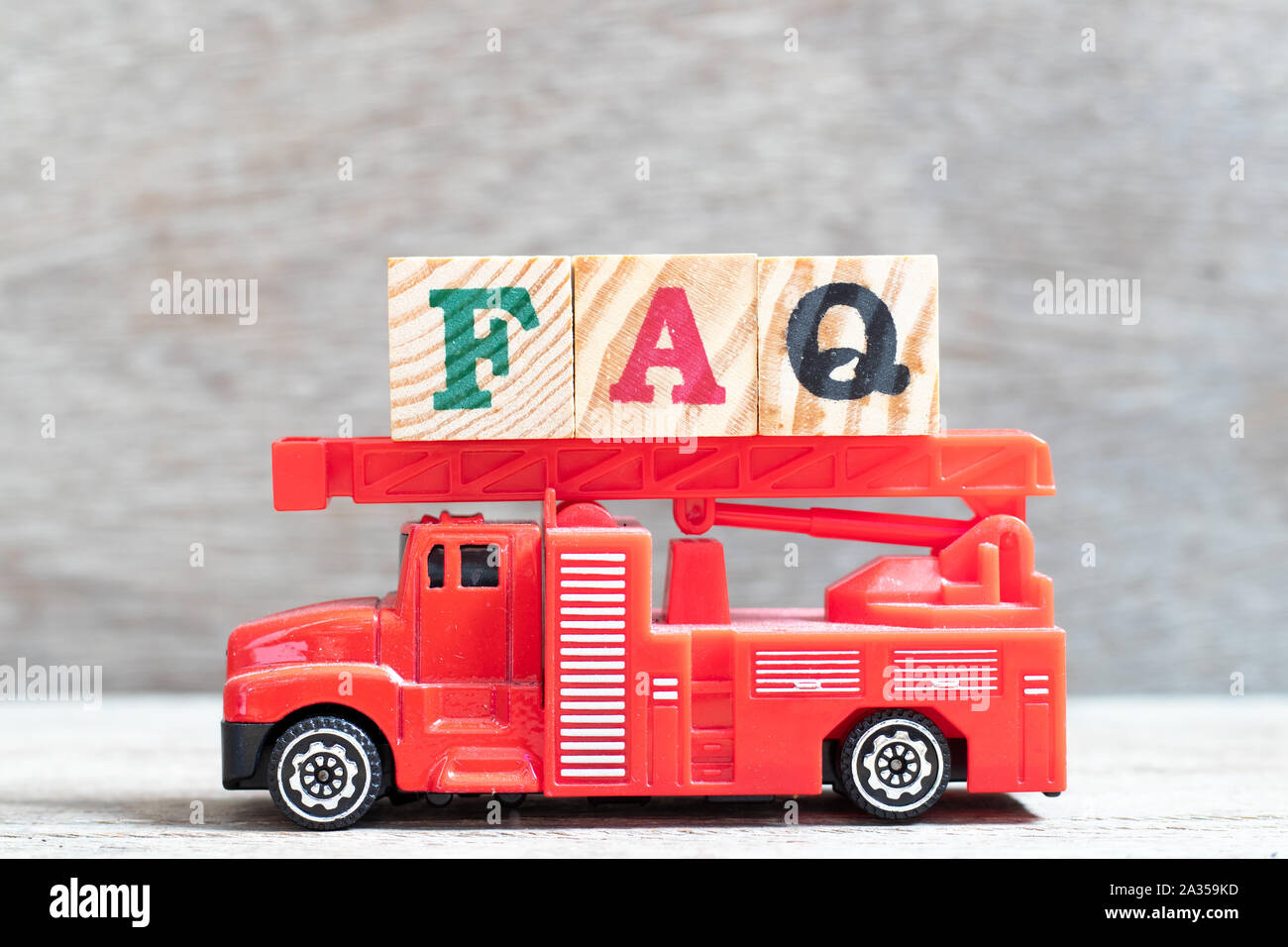 Red fire truck hold letter block in word FAQ (Abbreviation of ...