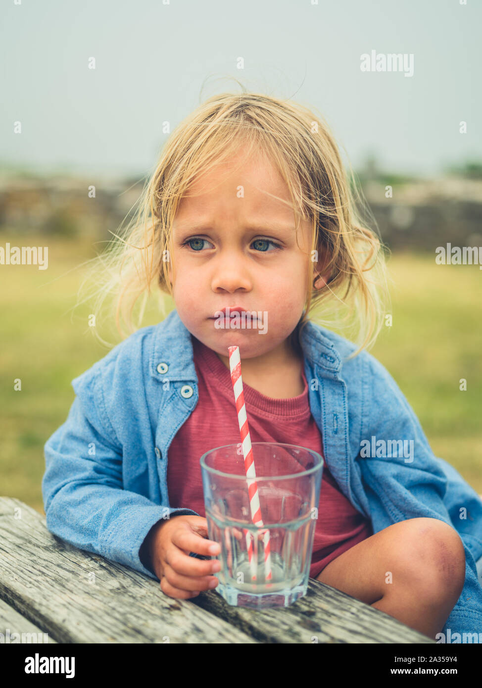Child drinking with straw hi-res stock photography and images - Alamy