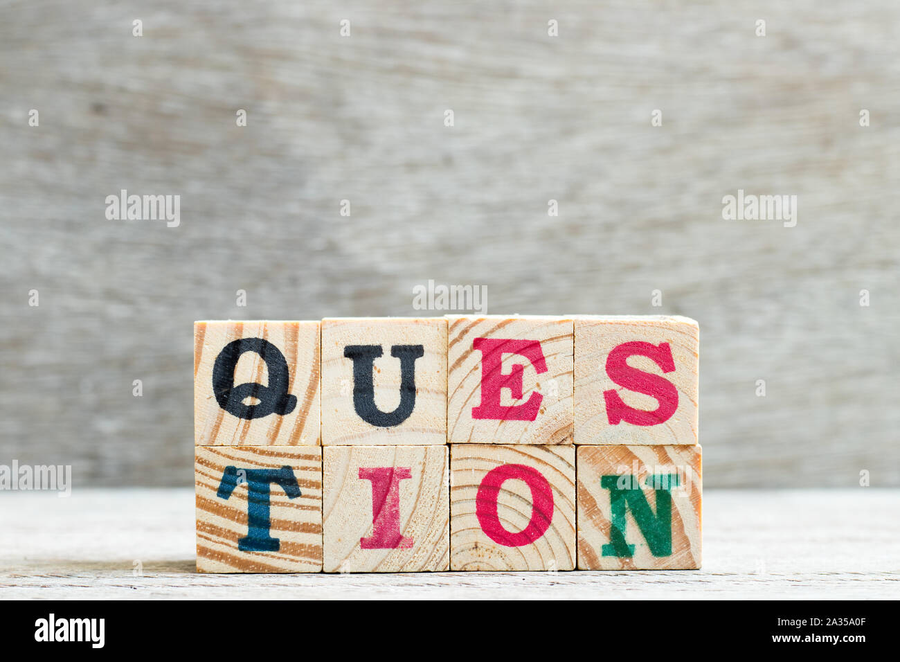 Letter block in word question on wood background Stock Photo - Alamy