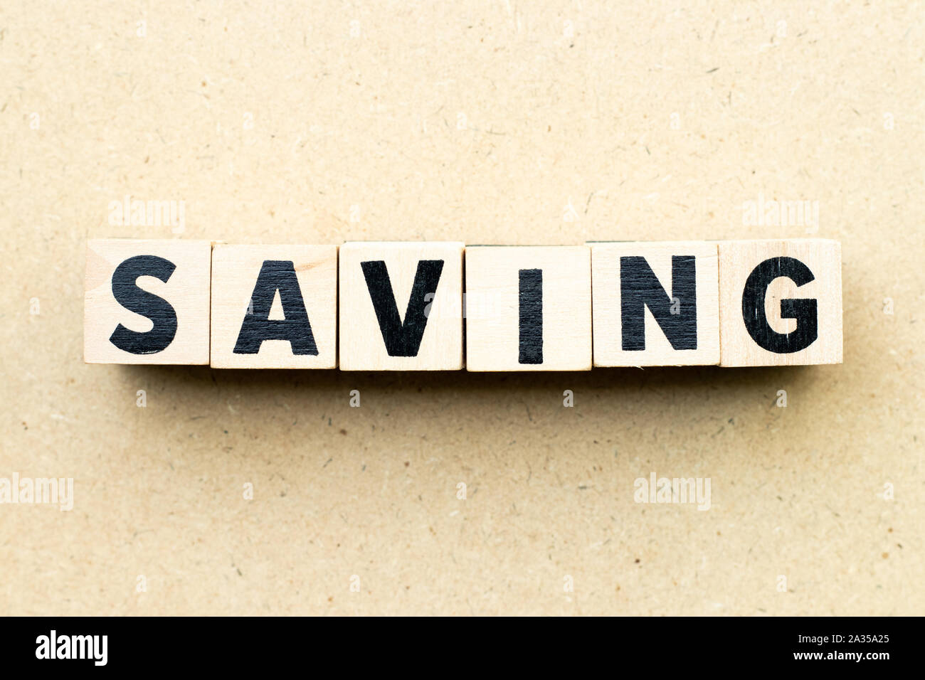 Letter block in word saving on wood background Stock Photo - Alamy