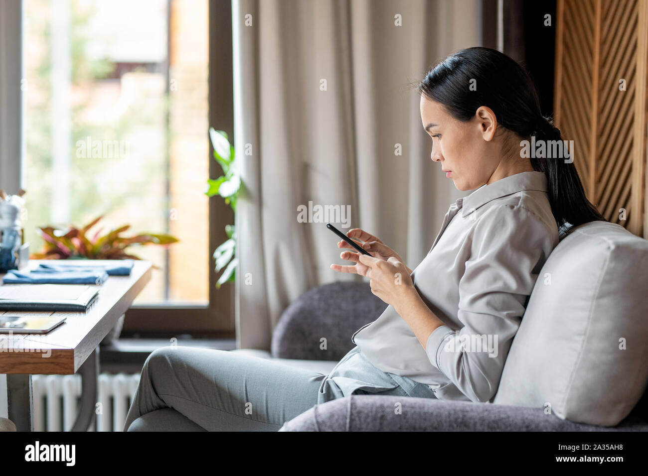 Cheerful person sitting on couch hi-res stock photography and images ...