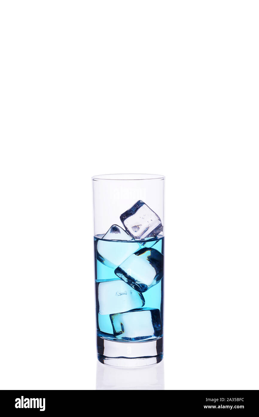 Glass with ice cubes, chilled drink bar, energy drink, colored liquid ...