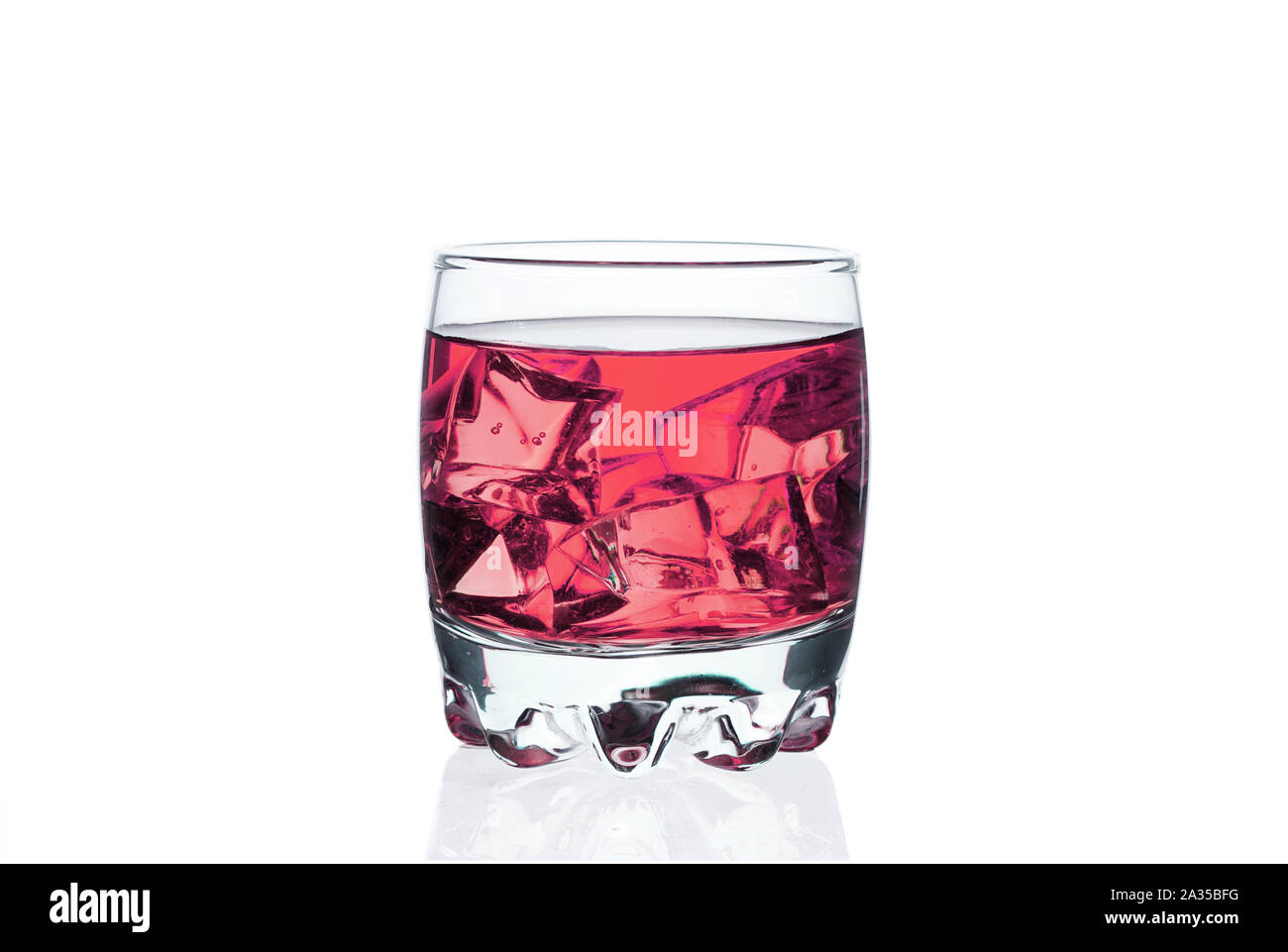 Glass with ice cubes, chilled drink bar, energy drink, colored liquid ...