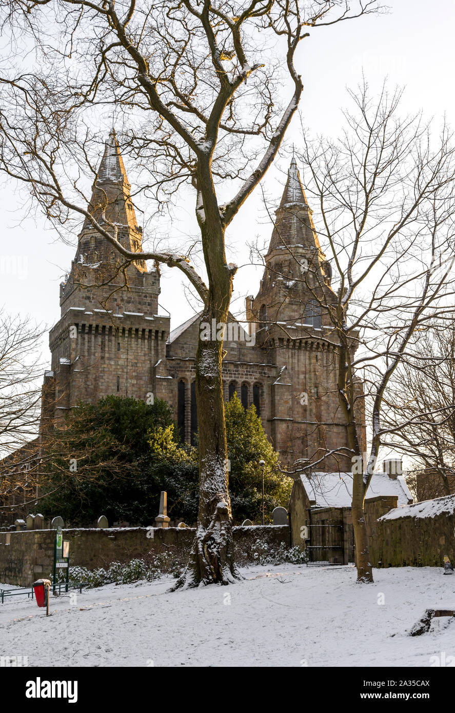 Twin towers of St Machar's Cathedral in Seaton park during winter ...