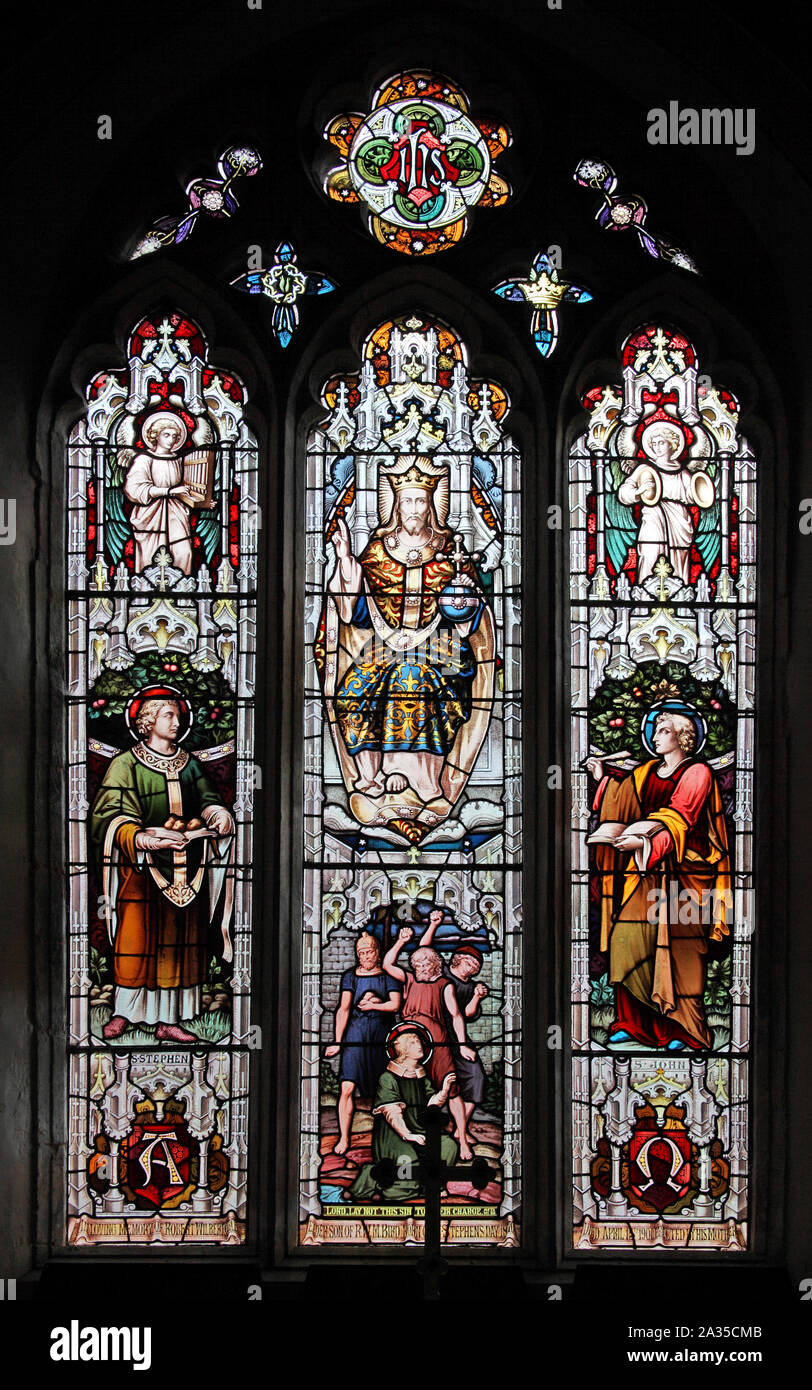 Stained glass window depicting Christ in Majesty, Saints John & Stephen ...