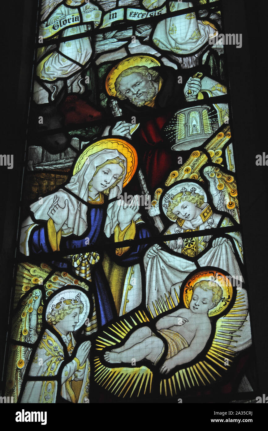 A stained glass window by the Kempe Studios. depicting The Holy Family ...