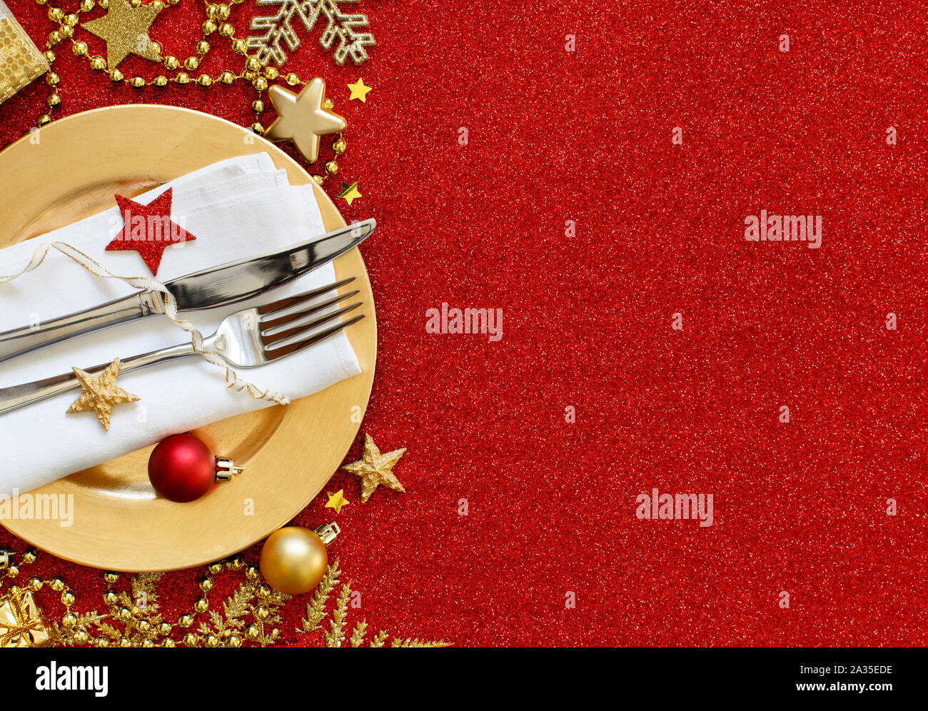 Red and golden festive table setting top view Stock Photo - Alamy