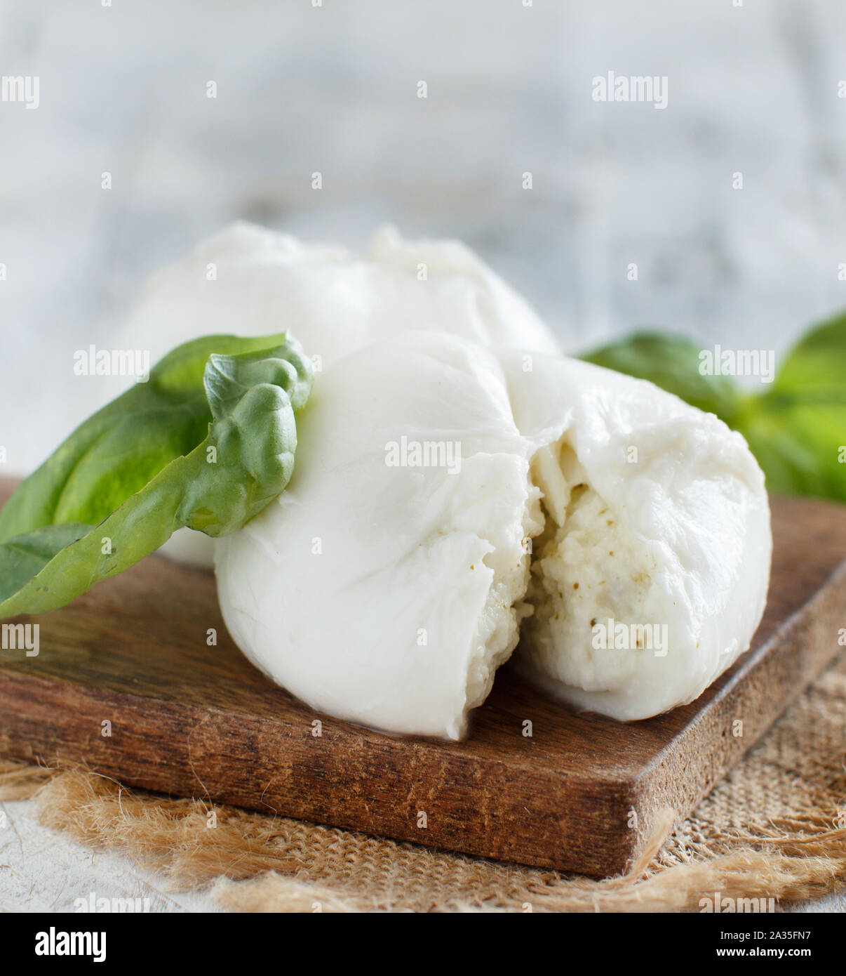 Italian mozzarella cheese stuffed with ricotta and persto close up ...