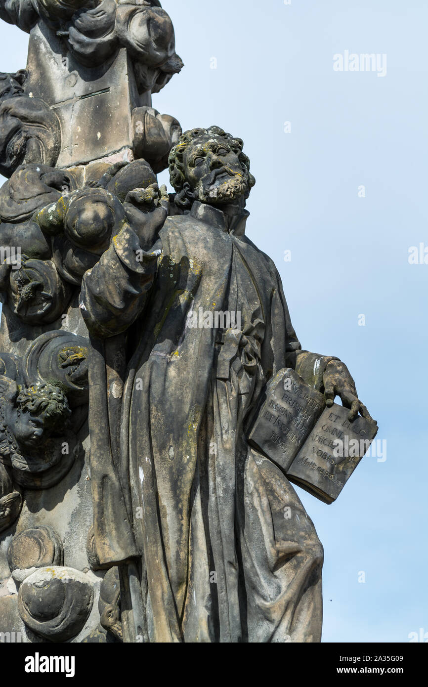 A statue of Saint Cajetan, holding a book at the Charles bridge, Prague ...