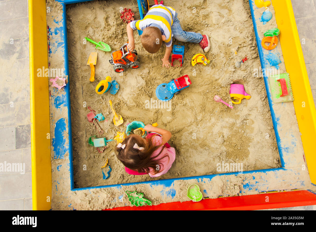 Top view of kids games in the sandbox Stock Photo - Alamy