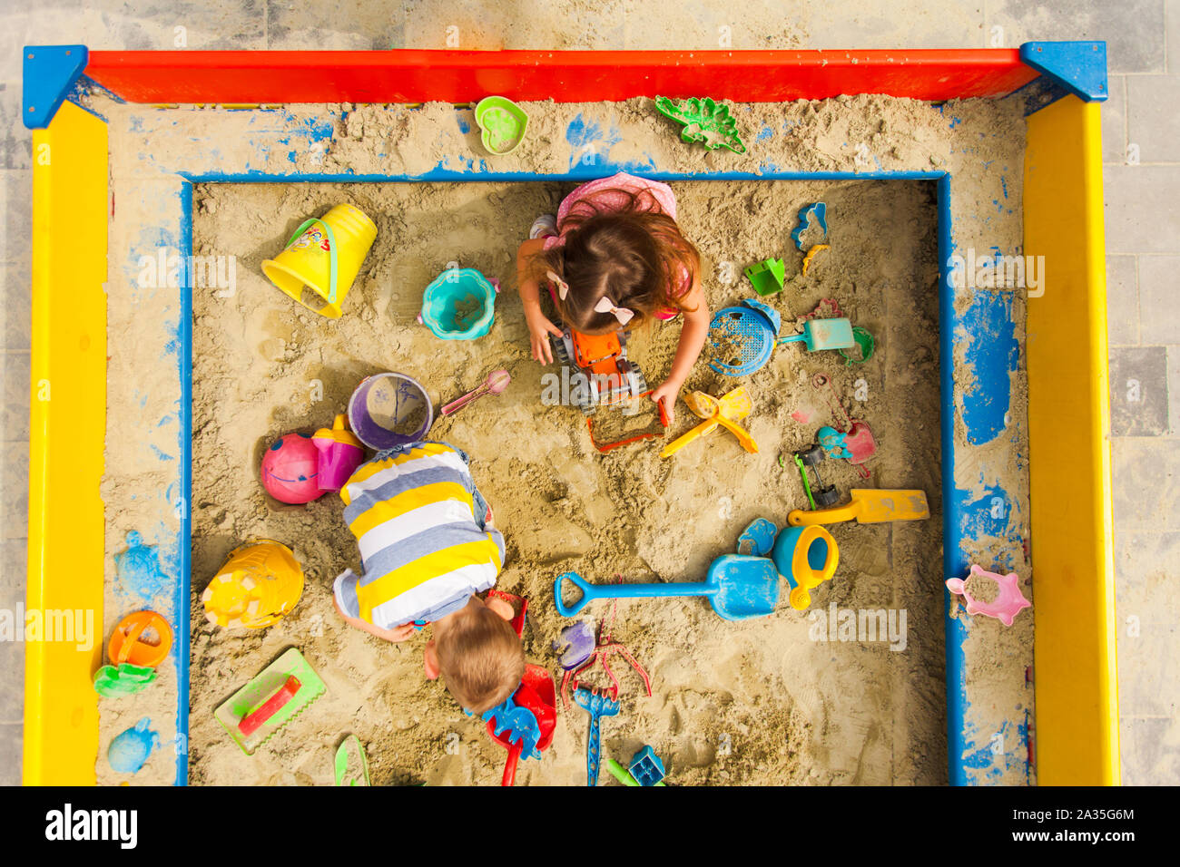 Top view of kids games in the sandbox Stock Photo - Alamy
