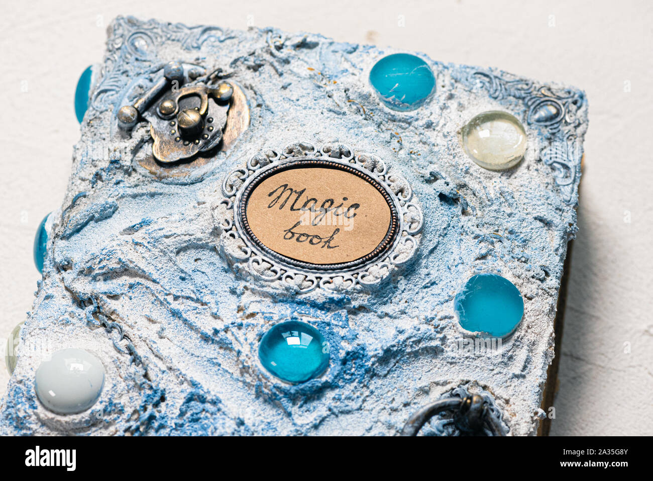White magic book on a white background. Wizard table Stock Photo - Alamy