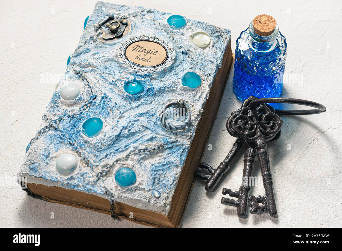 White magic book and magic potion on a white background. Wizard table ...