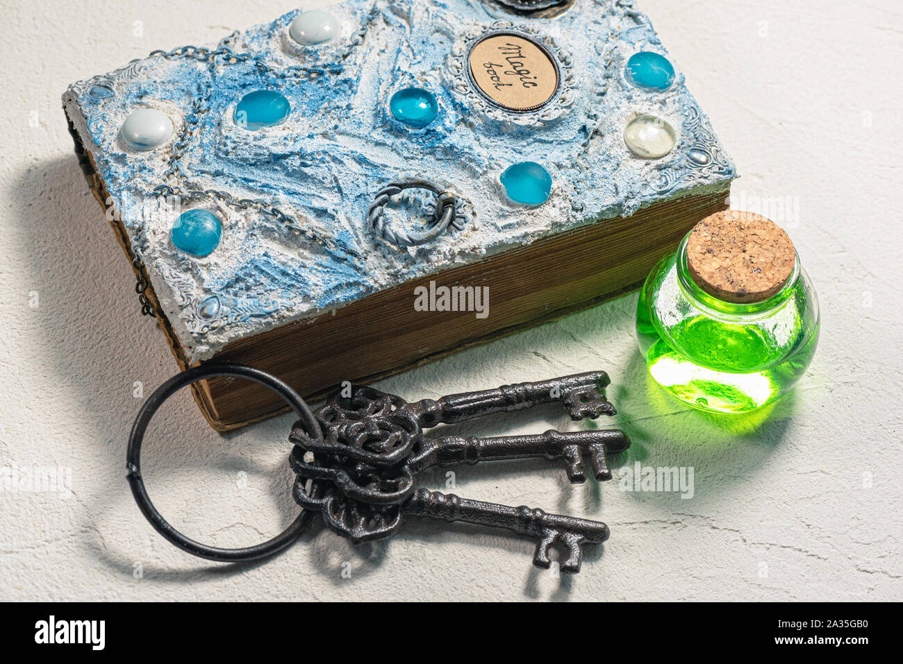 White magic book and magic potion on a white background. Wizard table ...