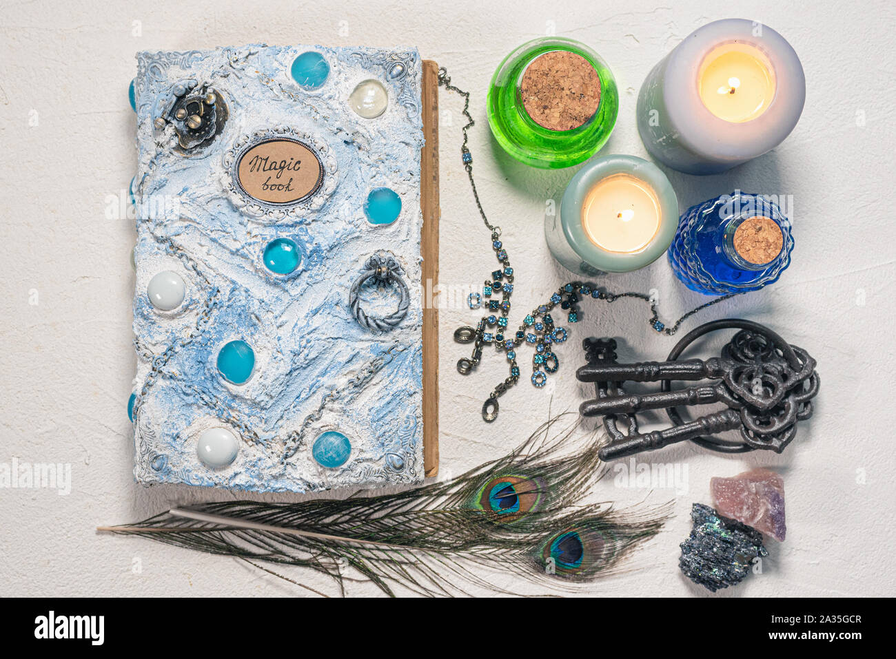 White magic book and magic potion on a white background. Wizard table ...