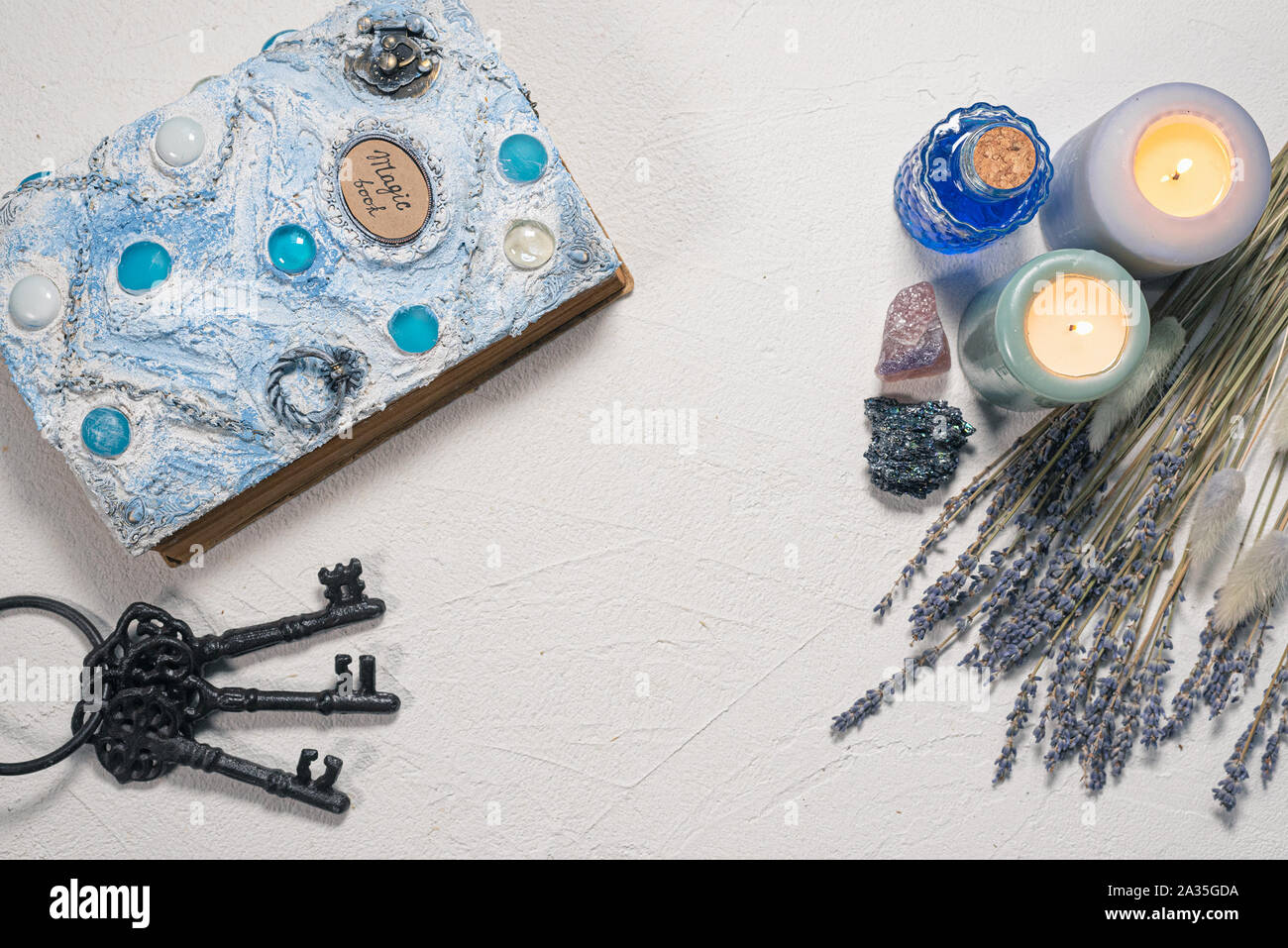 White magic book and magic potion on a white background. Wizard table ...