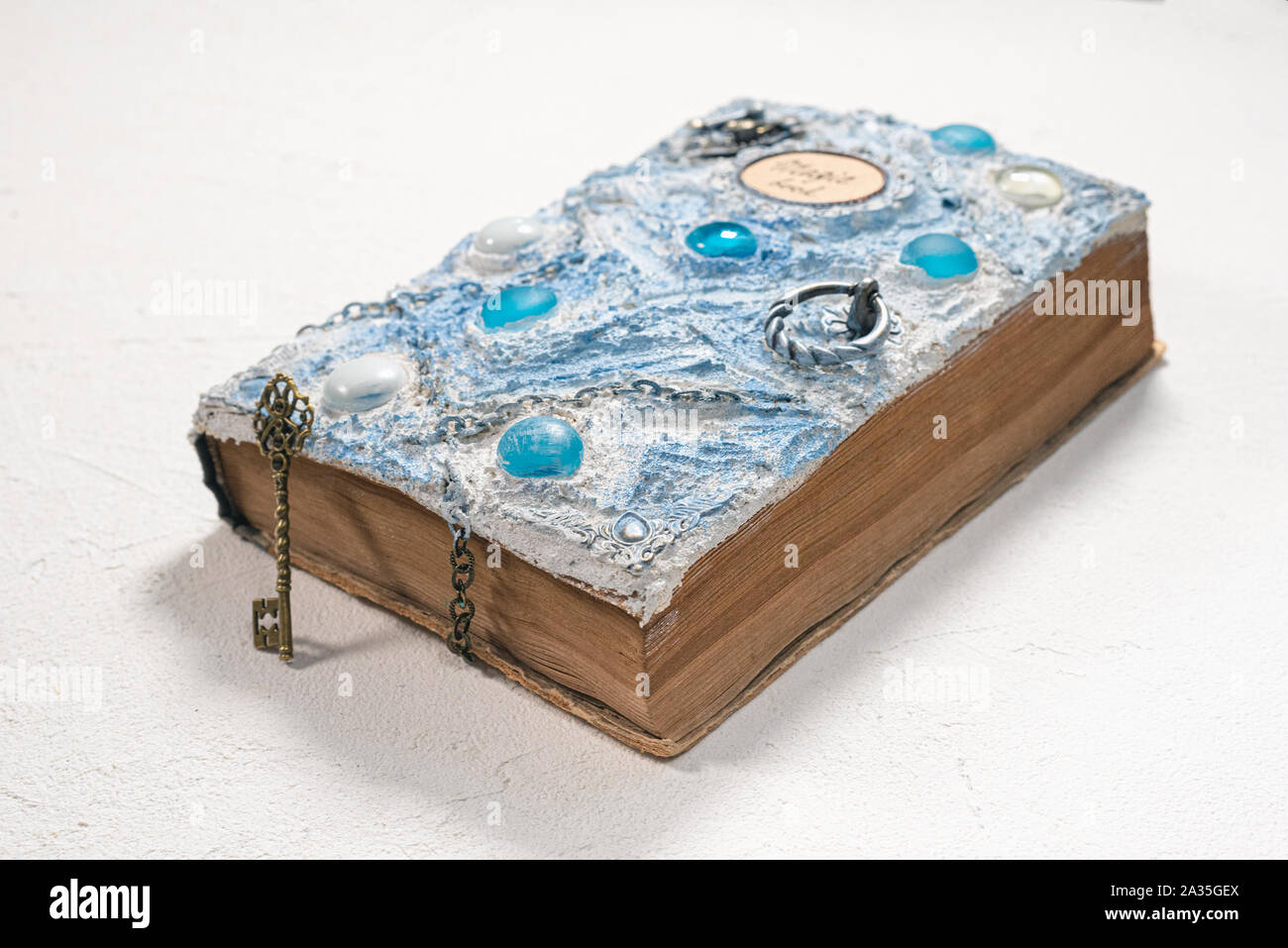White magic book on a white background. Wizard table Stock Photo - Alamy