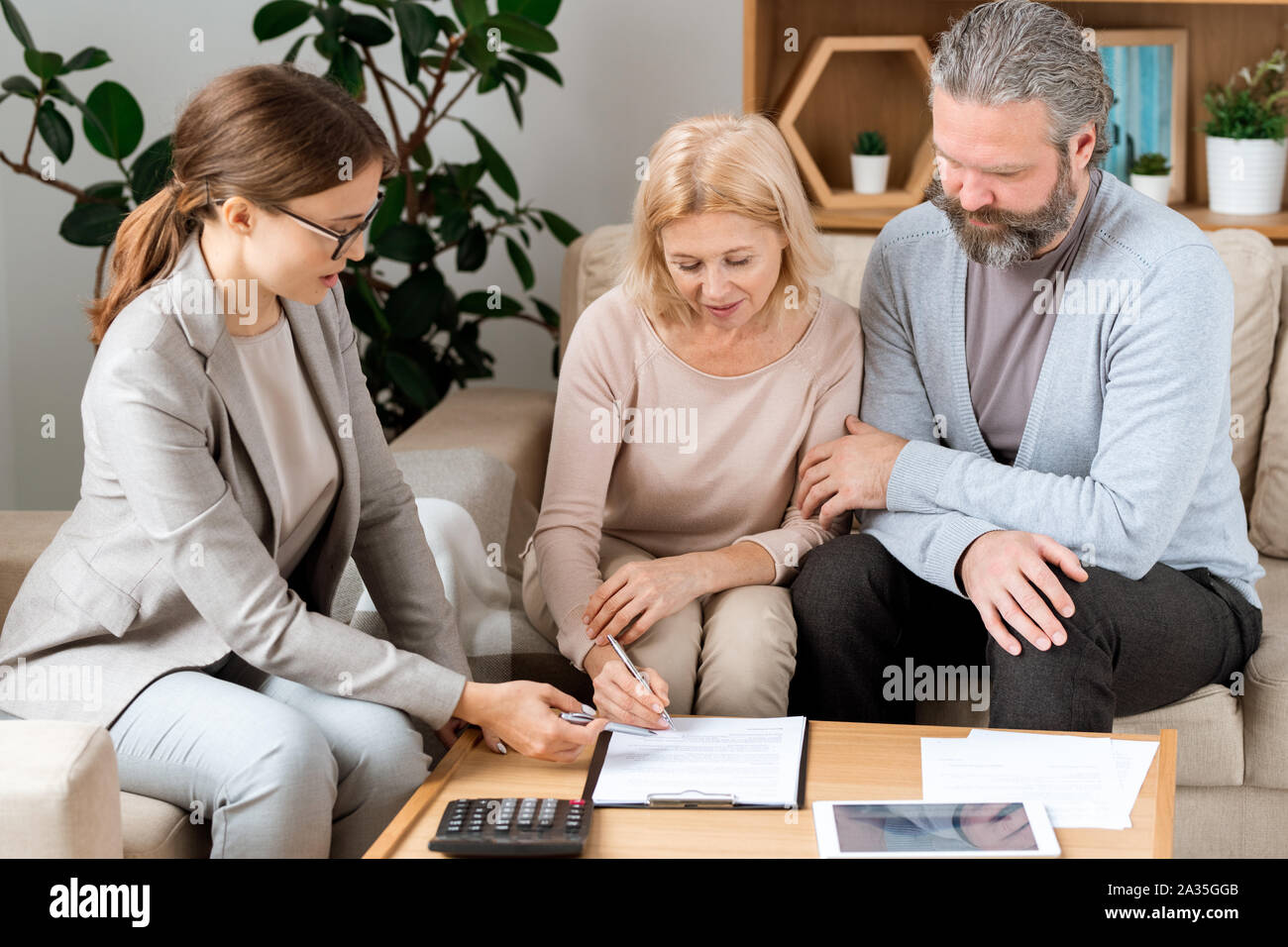 Young agent pointing place hi-res stock photography and images - Alamy