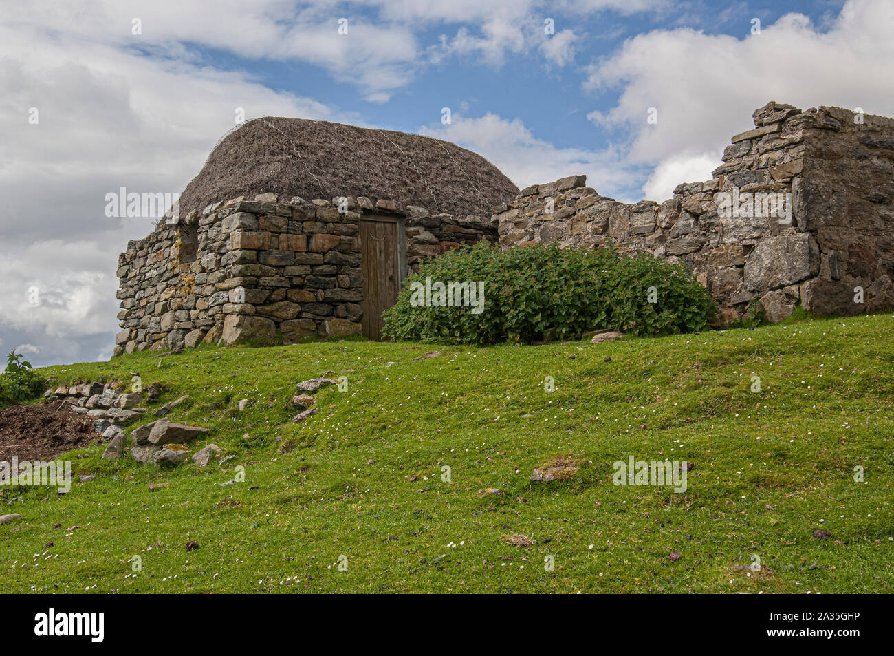 Abandoned croft on the shores of Loch Euphort, North Uist Western Isles ...