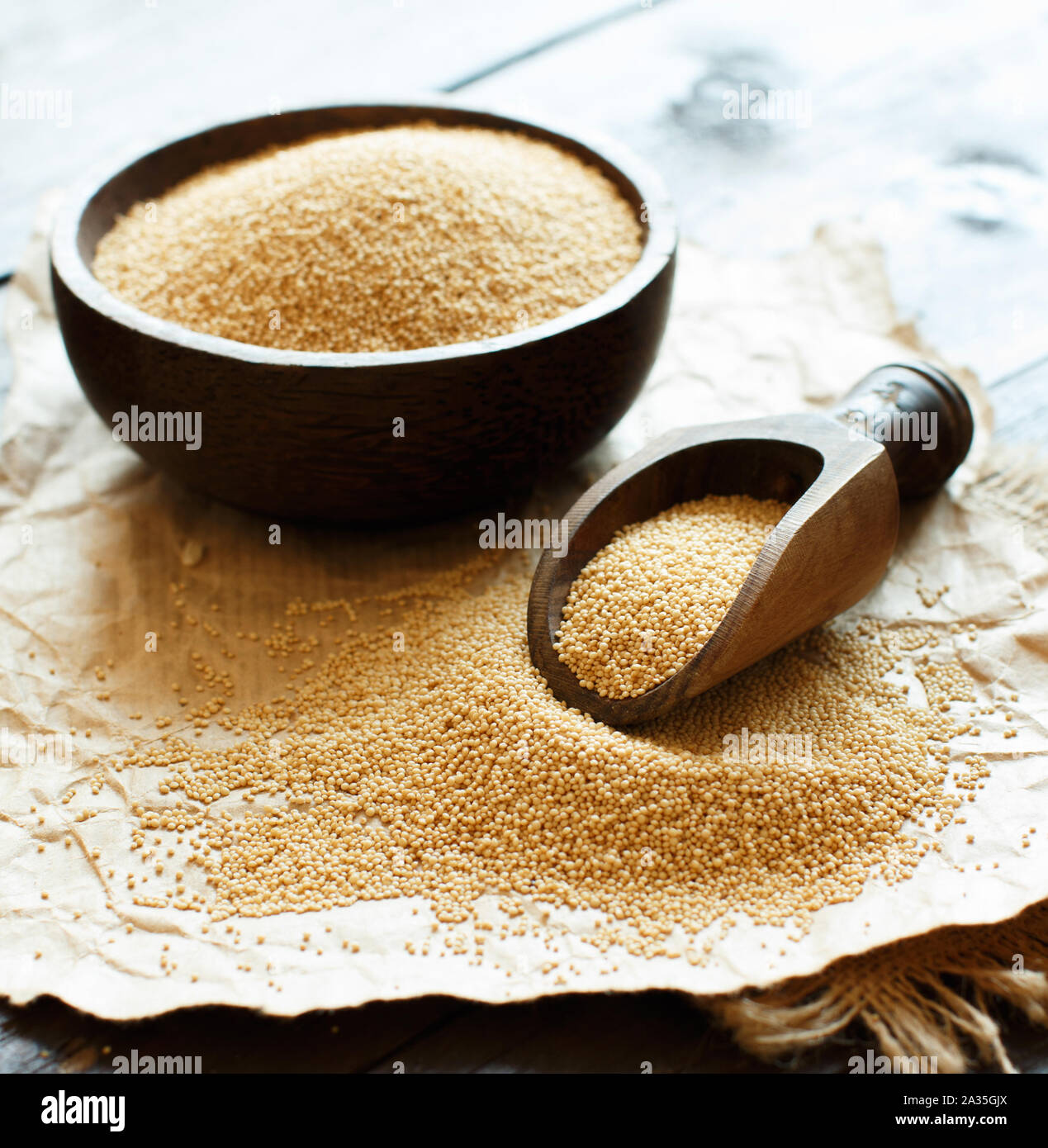 Raw Organic Amaranth grain in a bowl on wooden table Stock Photo - Alamy