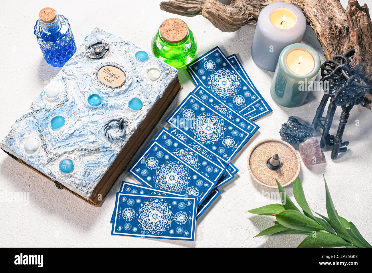 Tarot cards and white magic book on the white table background Stock ...