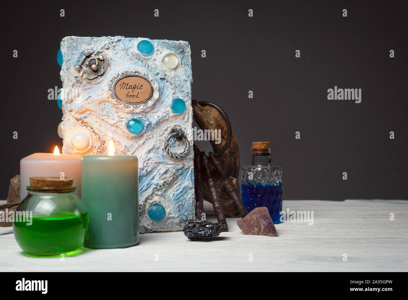 Magic book on a sorceress table. Witchcraft Stock Photo - Alamy