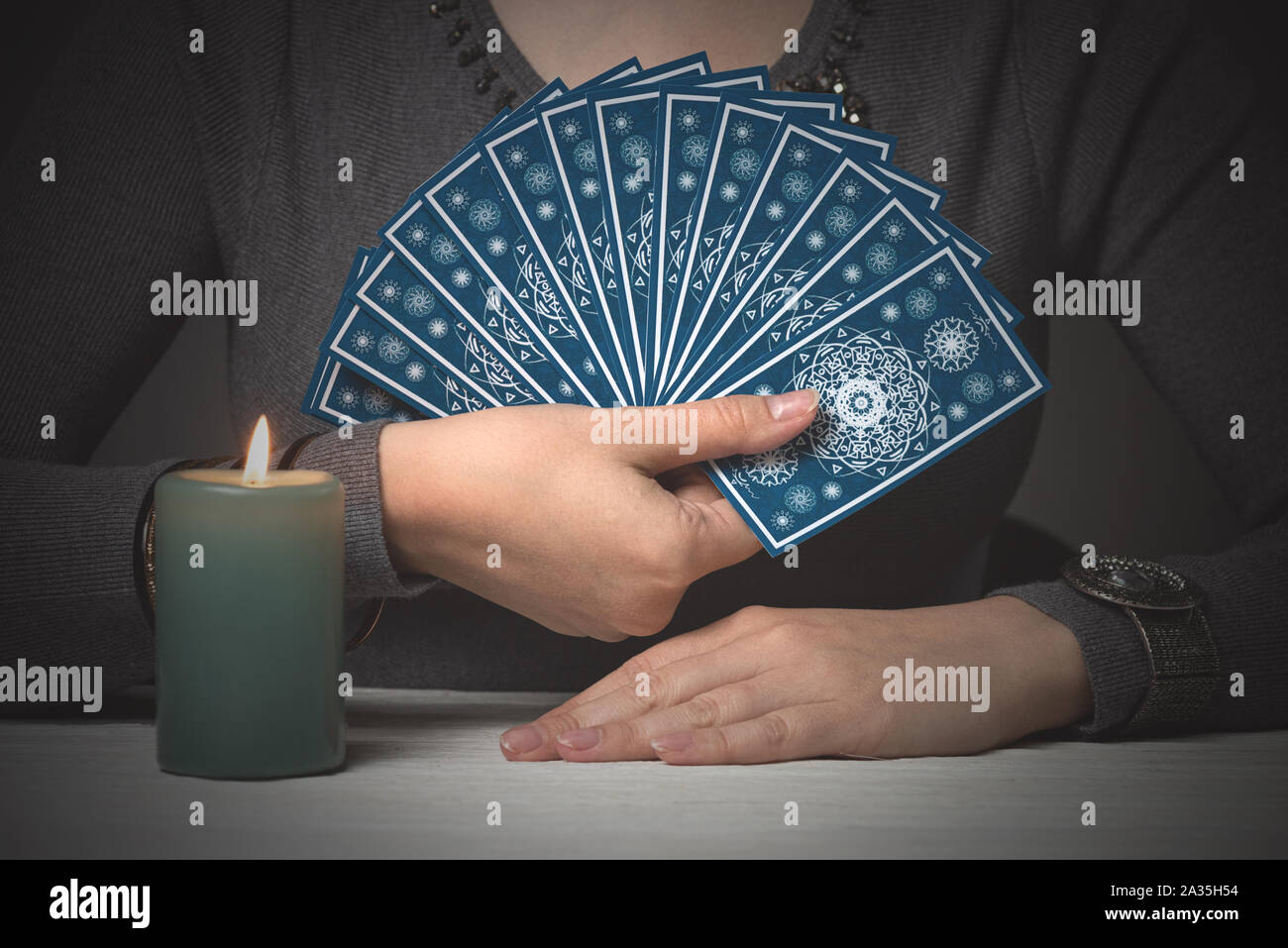Tarot cards in fortune teller hands. Divination. Future reading Stock ...