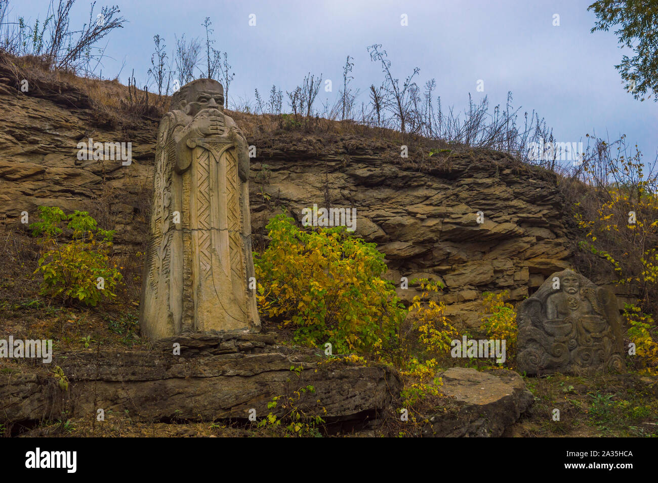 Stone Sculpture of Ancient Warrior with Sword Stock Photo - Alamy