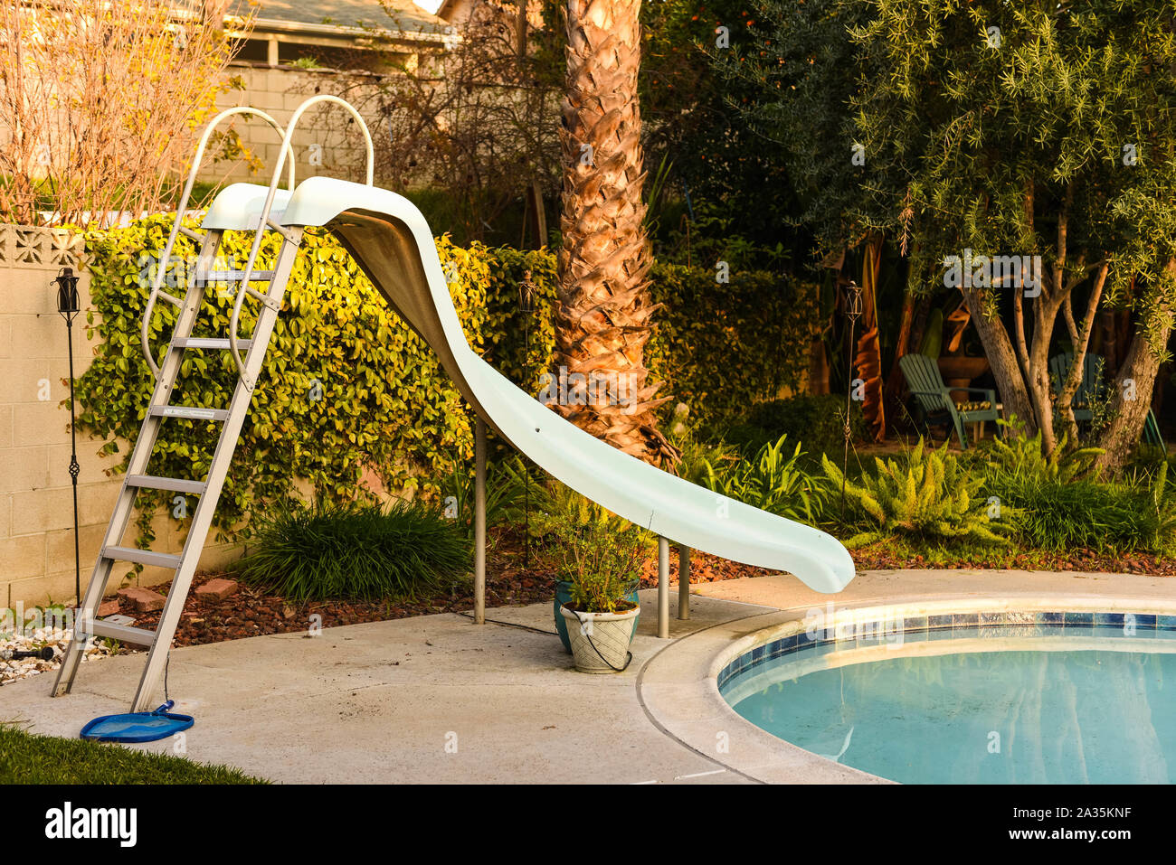 Swimming pool slide backyard hi-res stock photography and images - Alamy