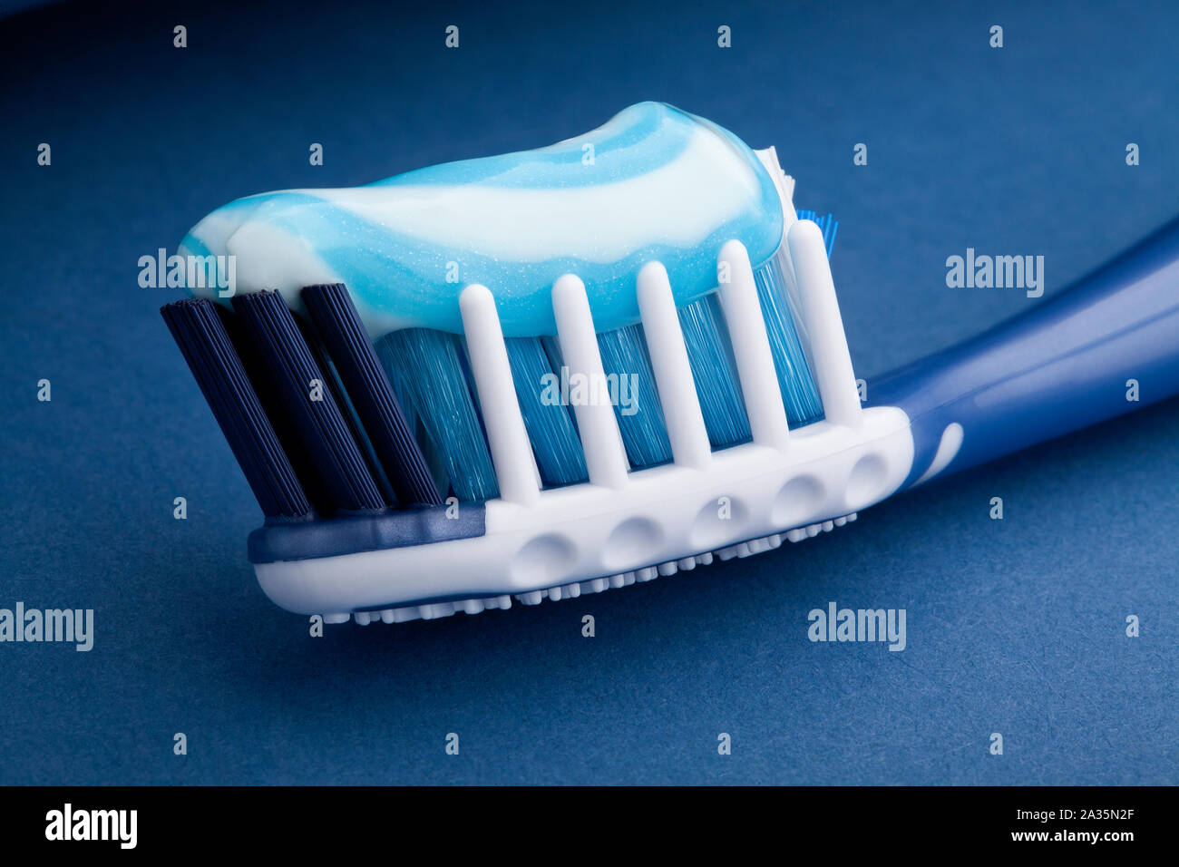 Toothbrush toothpaste blue background hi-res stock photography and ...