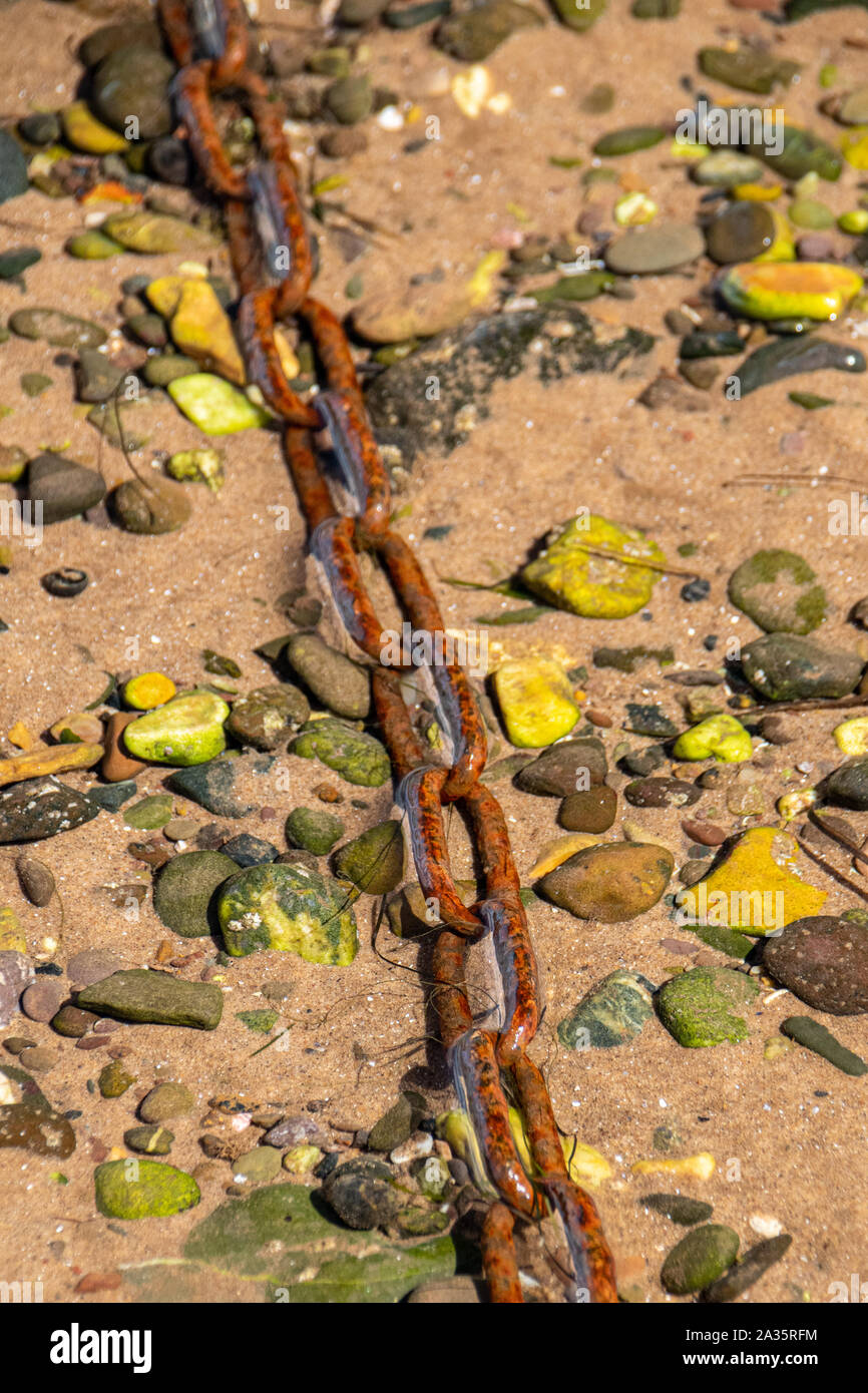 Rusty chain in sea water Stock Photo - Alamy